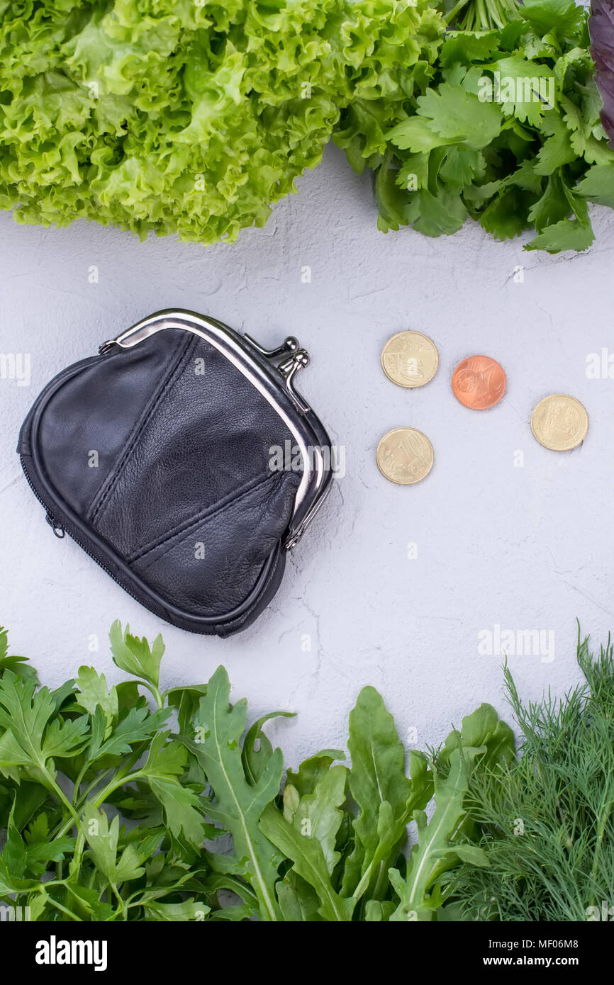 Fresh green vegetables and wallet with coins Stock Photo - Alamy