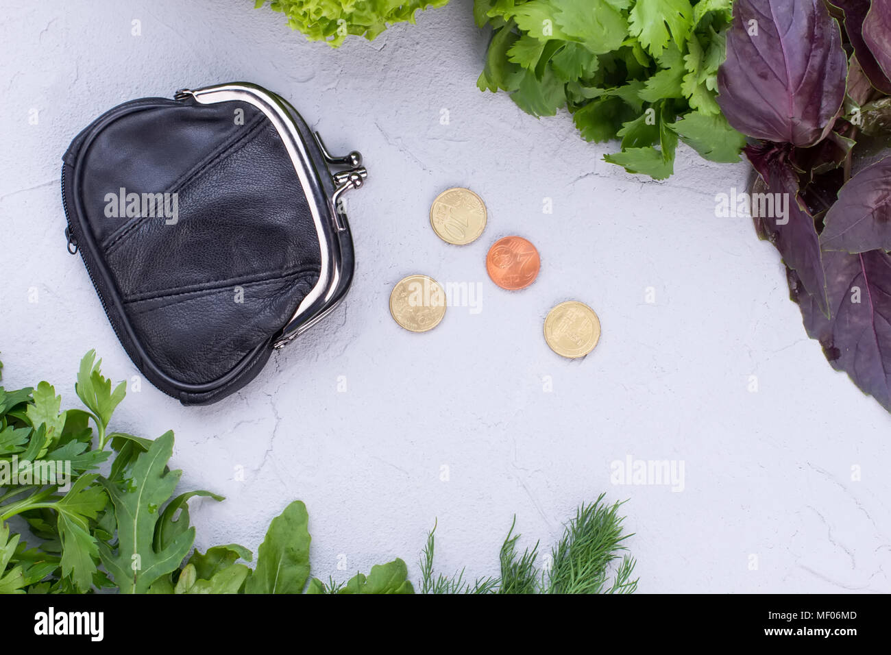 Wallet, coins and green organic food Stock Photo - Alamy