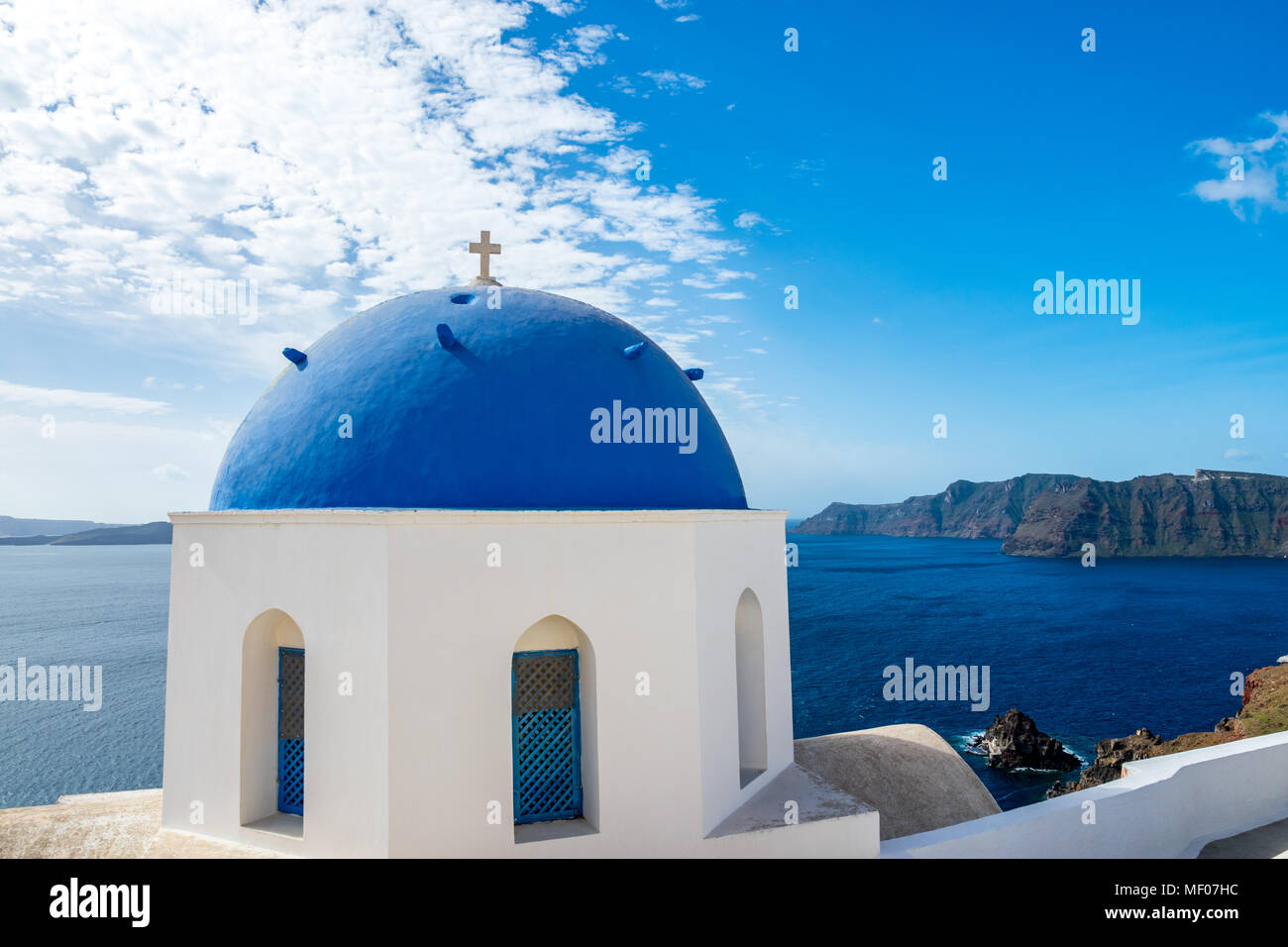 Closeup view of Santorini famous blue dome building with blue ...