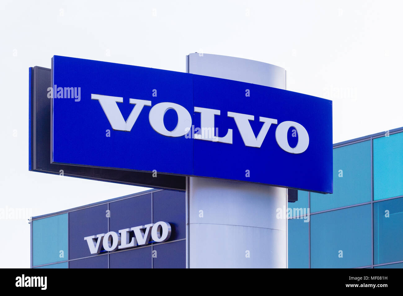 Volvo automobile dealership sign and logo. Volvo is a Swedish ...