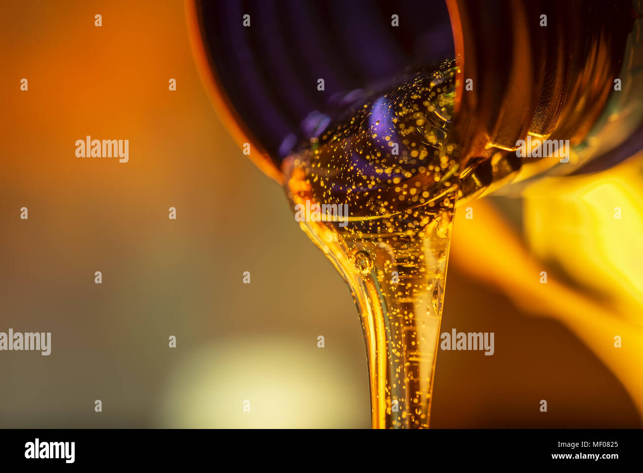 Gold liquid flow hi-res stock photography and images - Alamy