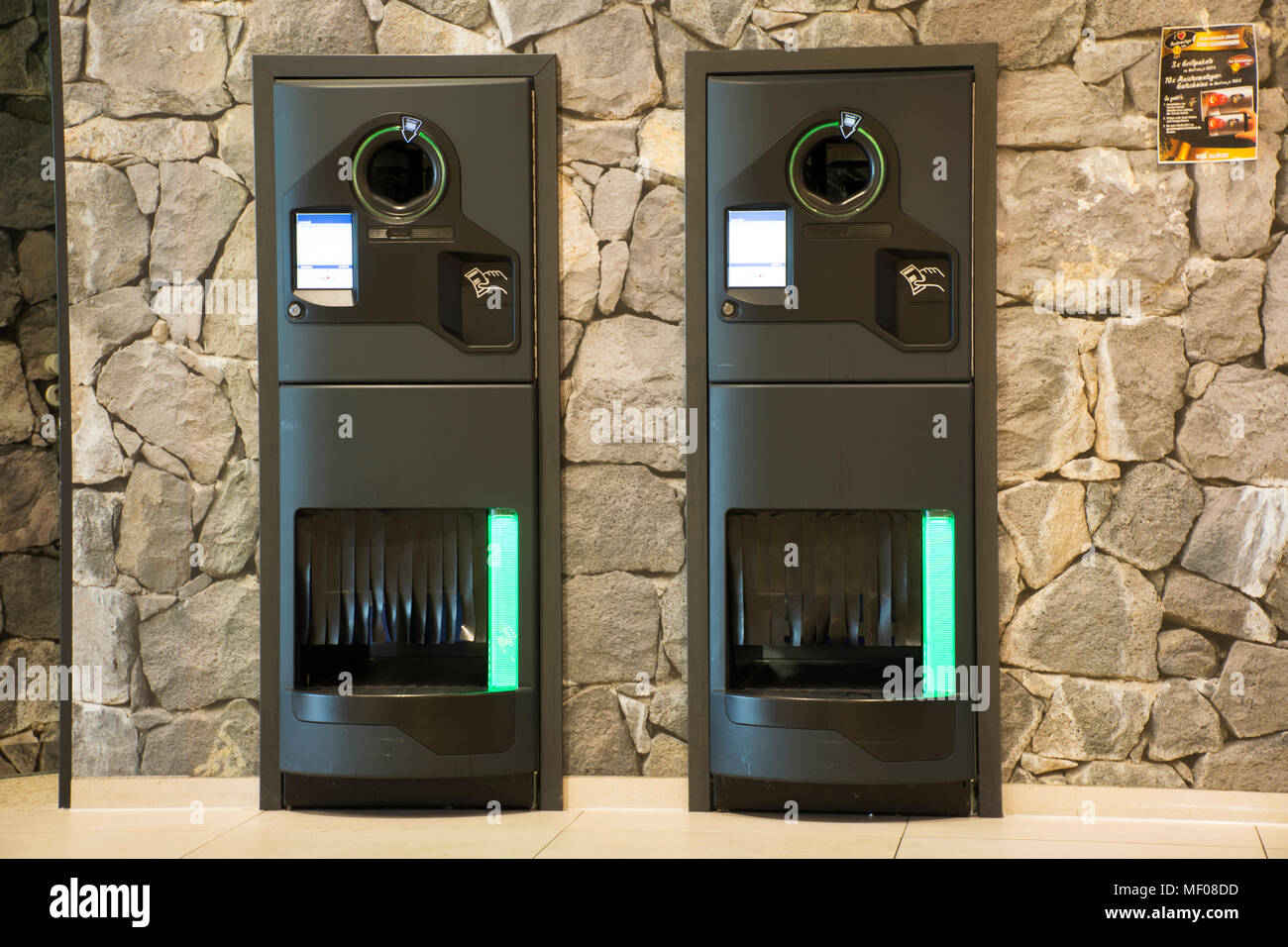 German people put and return empty bottle into Reverse Vending Machine ...