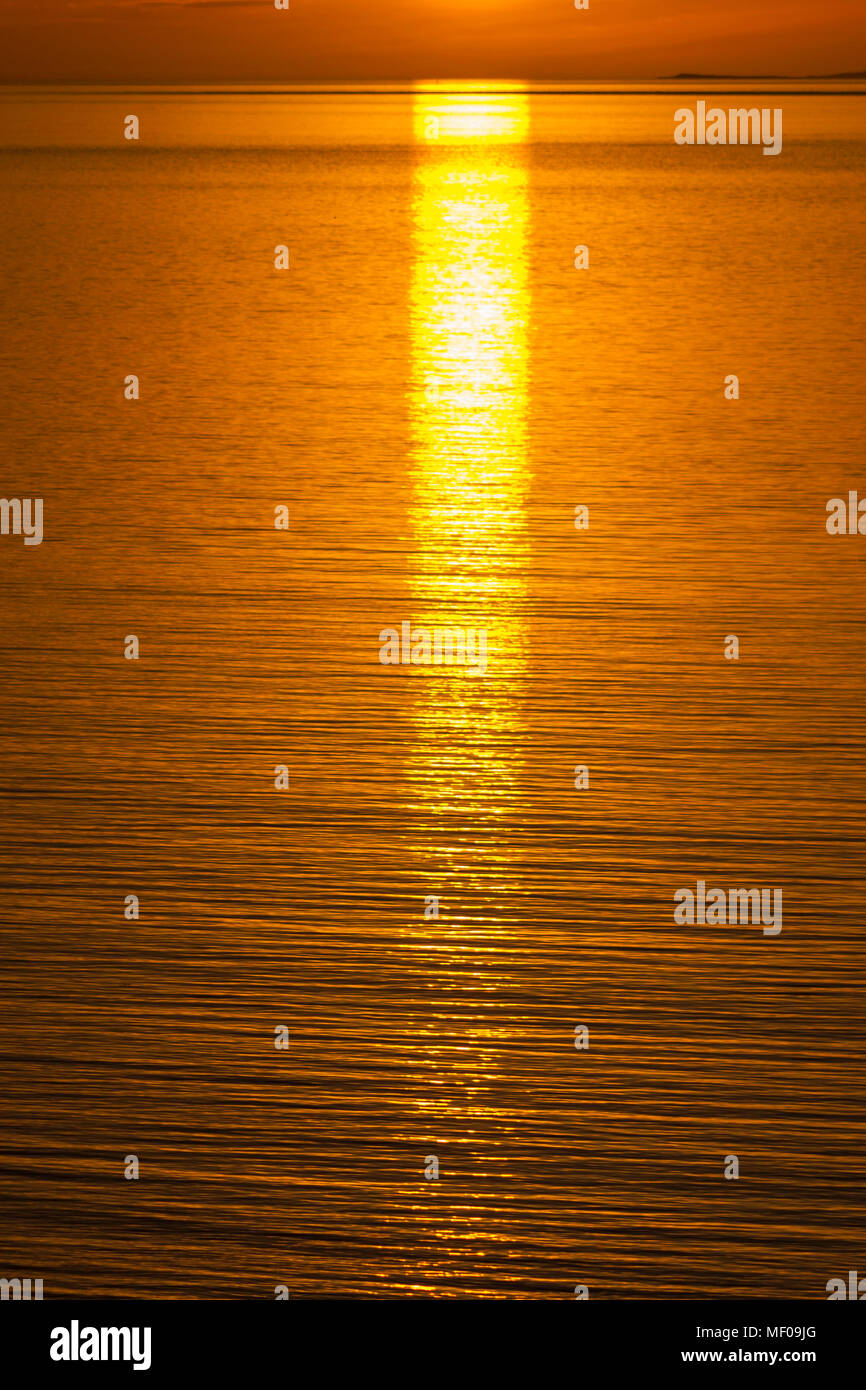 Sunset with a streak of sunlight Stock Photo - Alamy