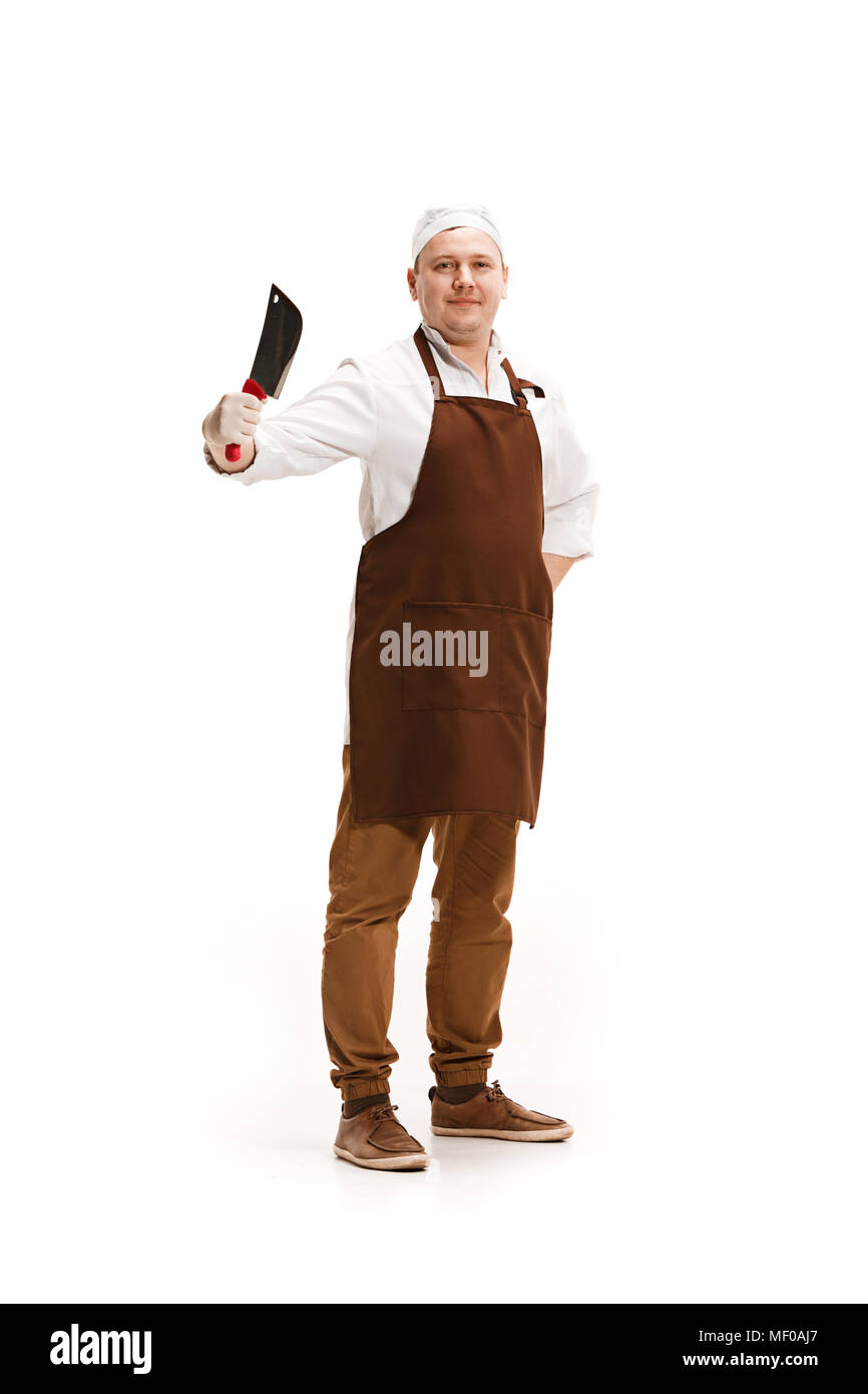 Smiling butcher posing with a cleaver isolated on white background ...