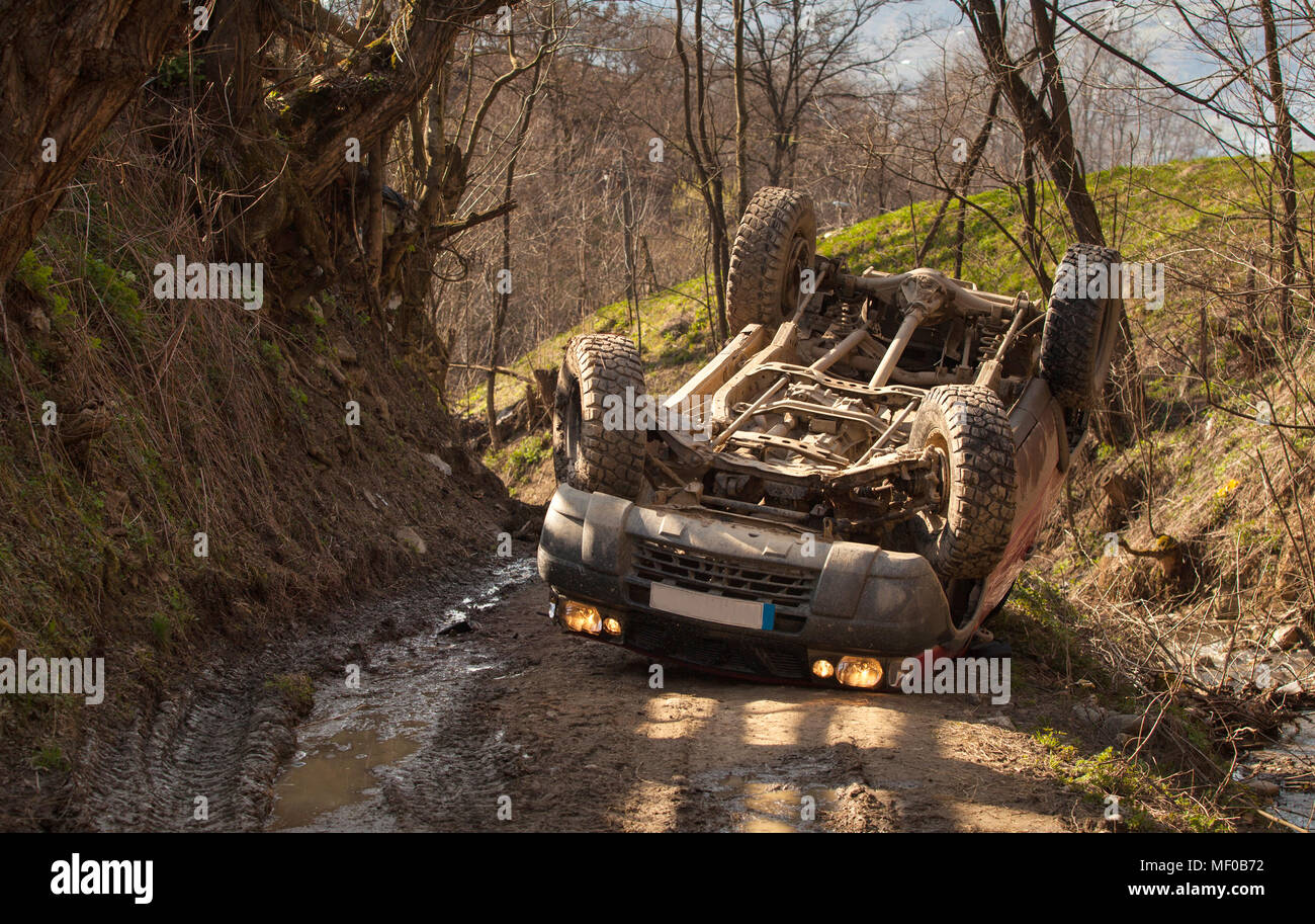 Offroad rollover accident, car flipped on mountain road Stock Photo - Alamy
