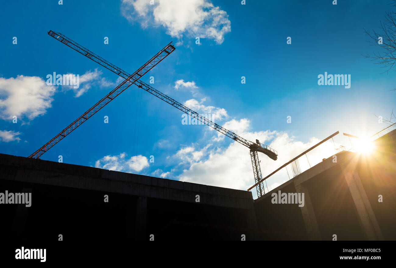 Cranes over construction site Stock Photo - Alamy