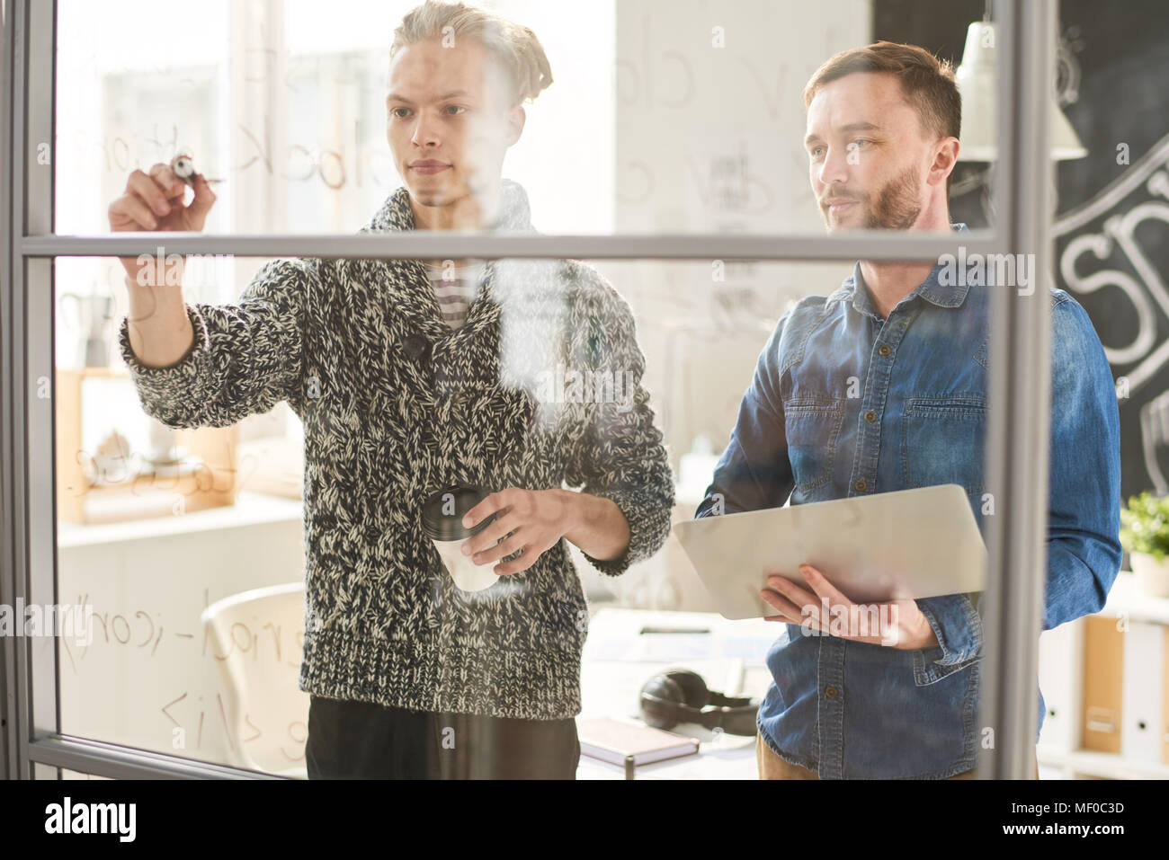 Creative coding team working on new project Stock Photo - Alamy
