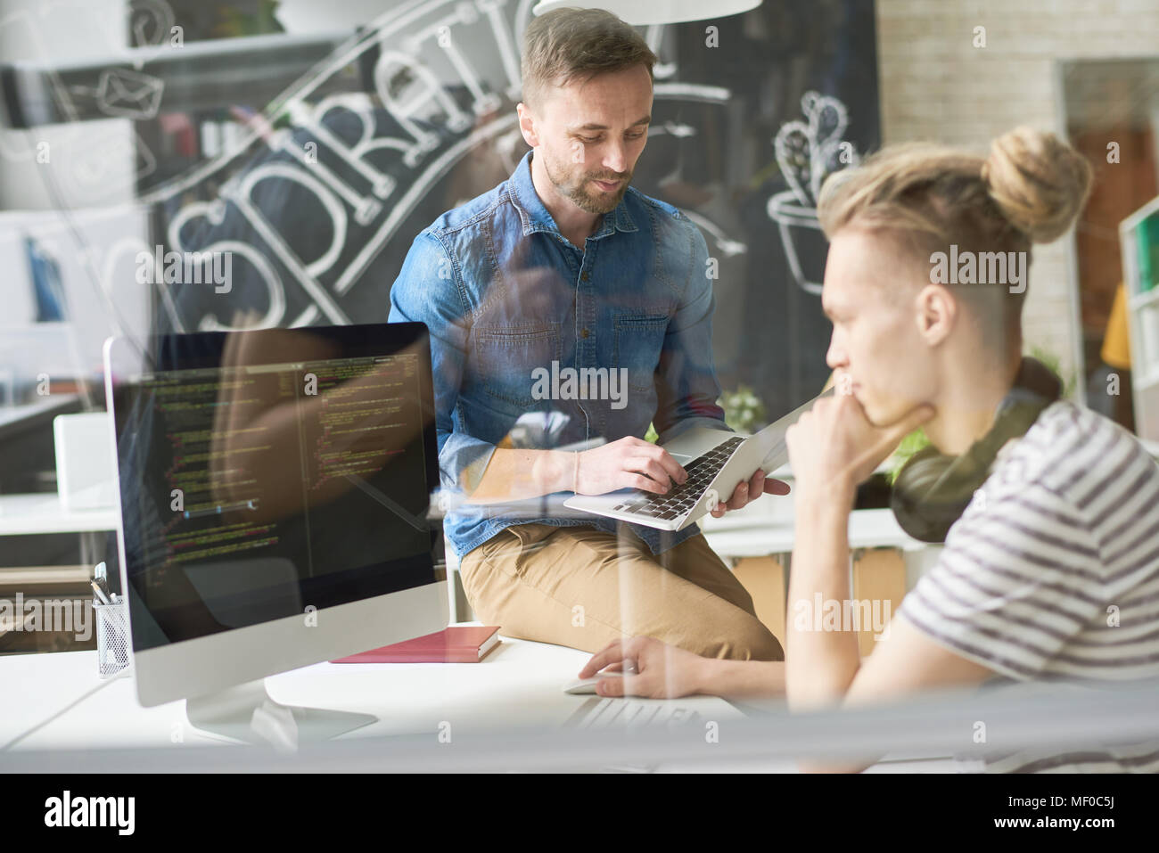 Hipster programmers creating new website script Stock Photo - Alamy