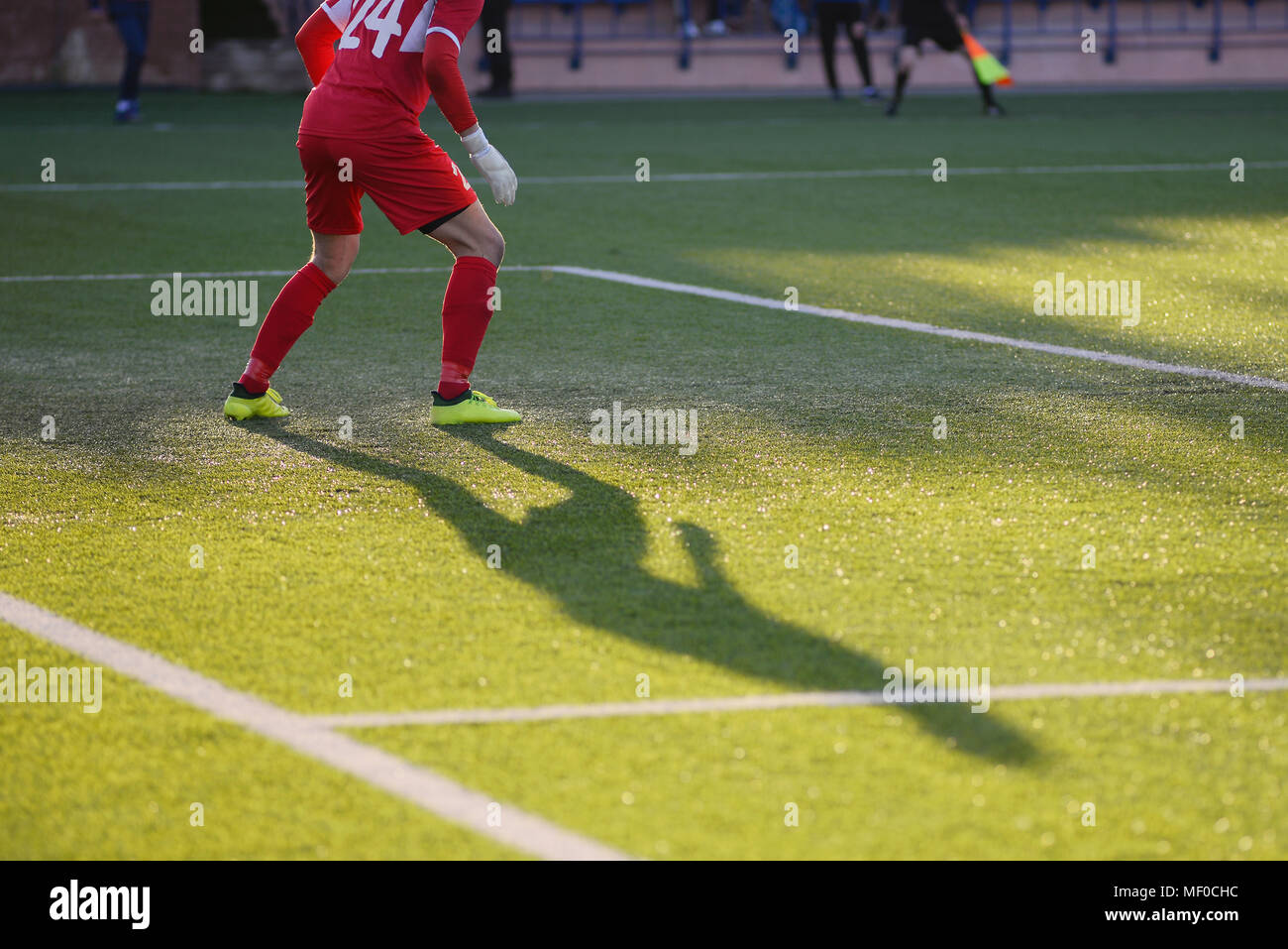 Soccer player shadow on the green artificial football field Stock Photo ...