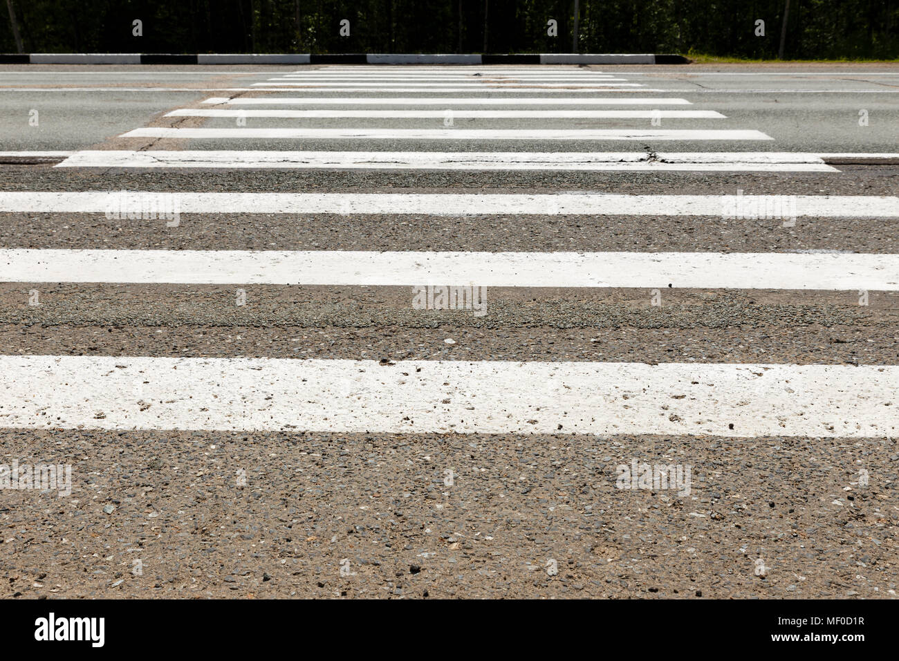 white pedestrian crossing across the road Stock Photo - Alamy