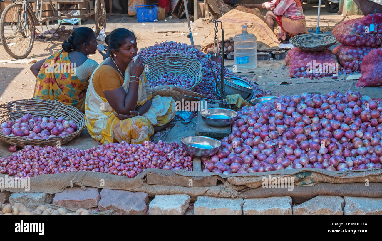 Madurai, India - March 9, 2018: Women traders with onions for sale at a ...