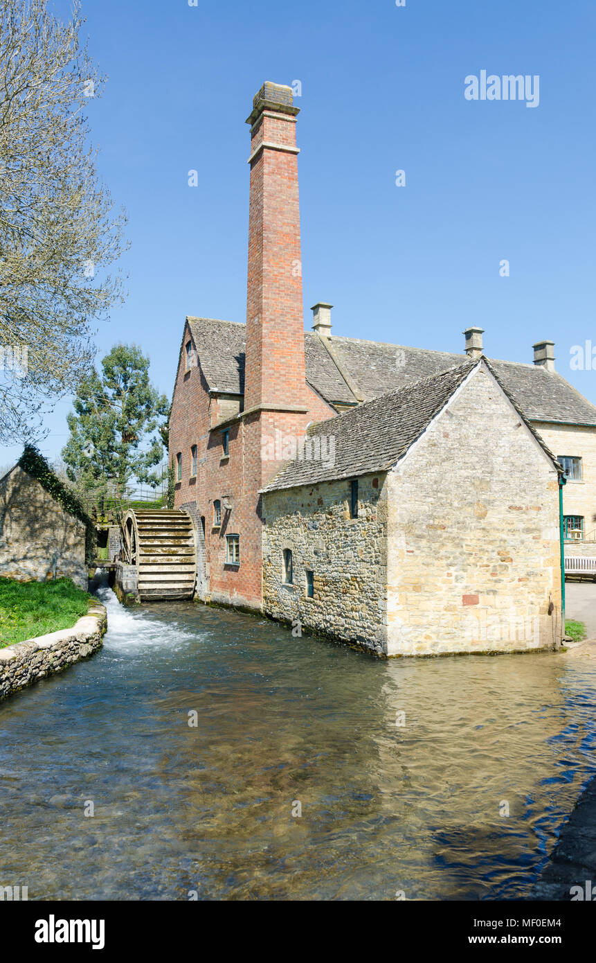 Old water mill on the River Eye in the pretty Cotswold village of Lower ...