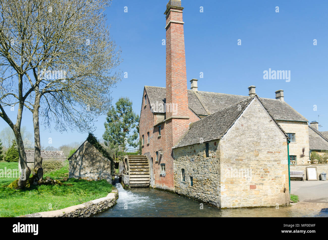 Old water mill on the River Eye in the pretty Cotswold village of Lower ...