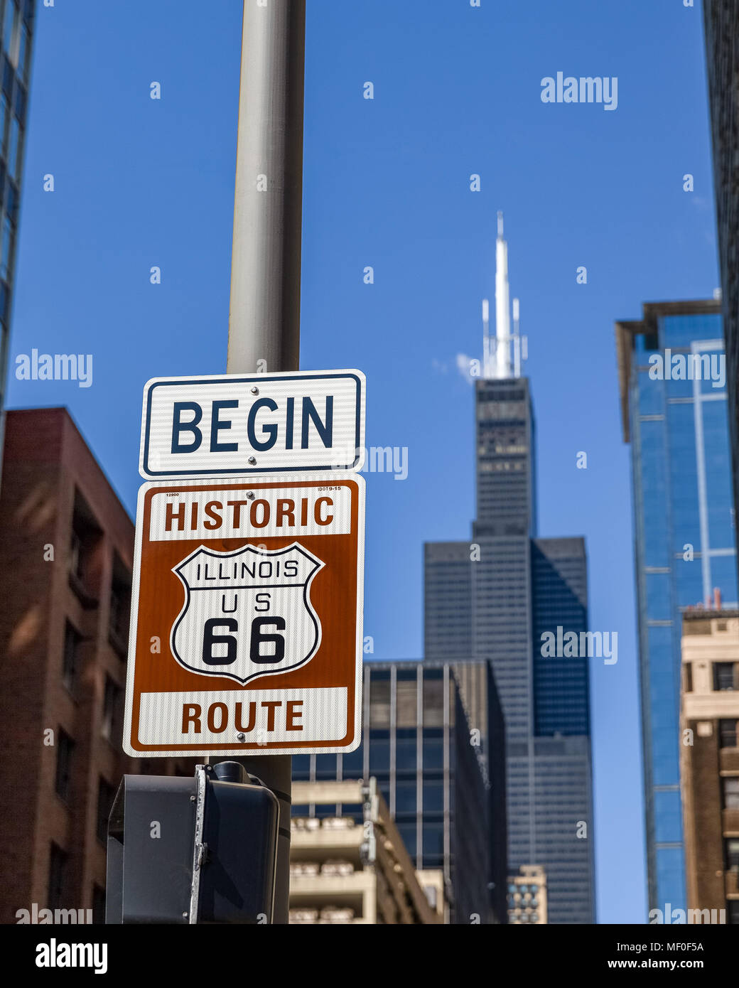Sign marking the beginning of historic Route 66 in Chicago with Sears ...