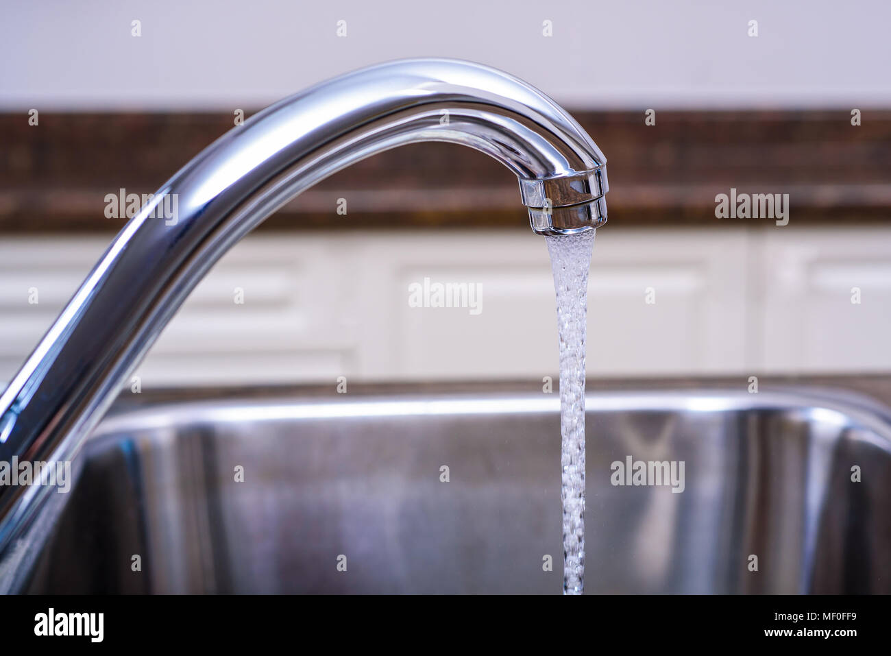 Kitchen tap with flowing water Kitchen tap with flowing water Stock ...