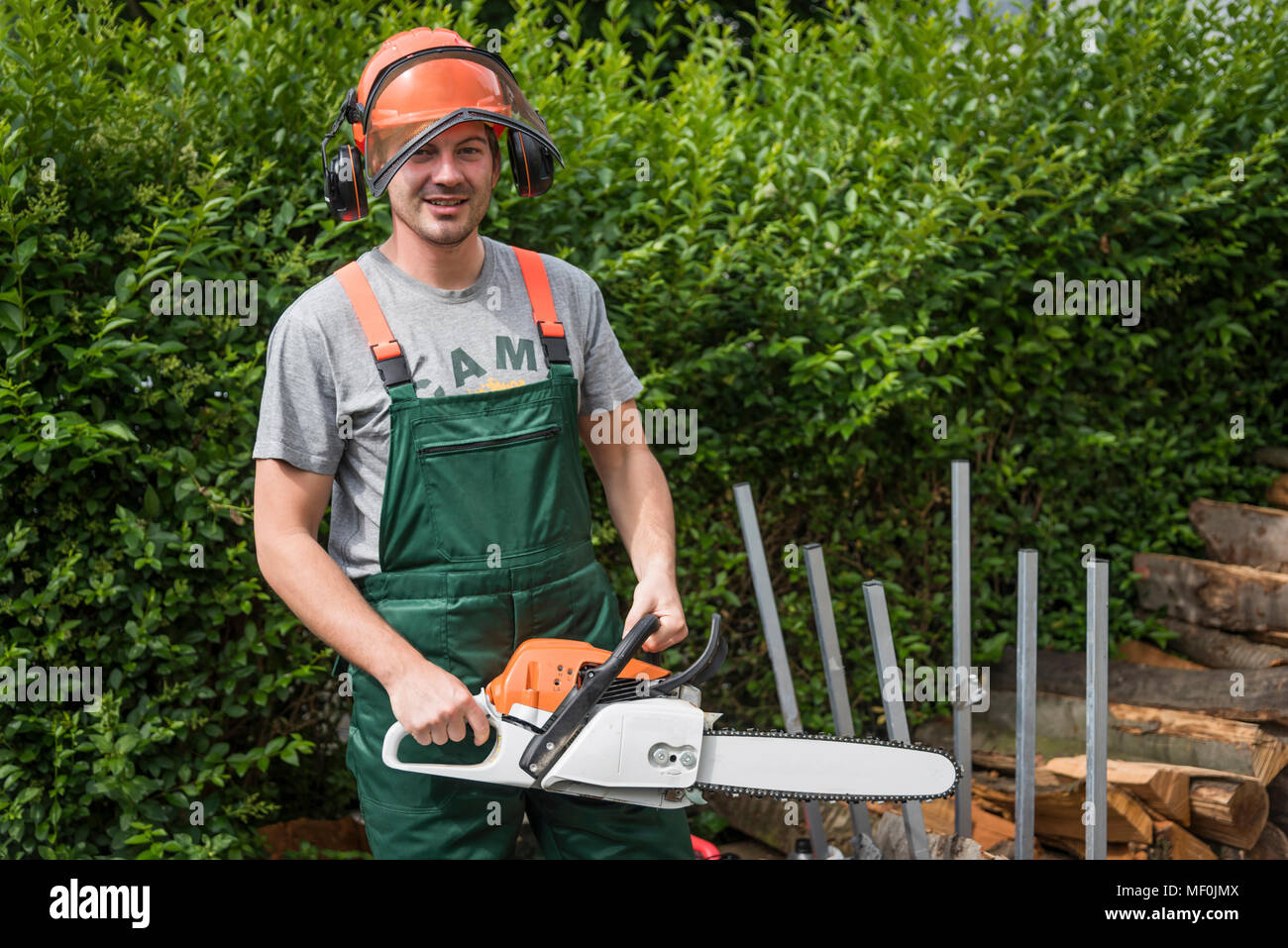 Man with saw hi-res stock photography and images - Alamy