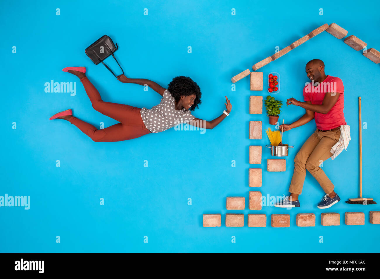 Woman coming home from work, husband preparing food Stock Photo - Alamy