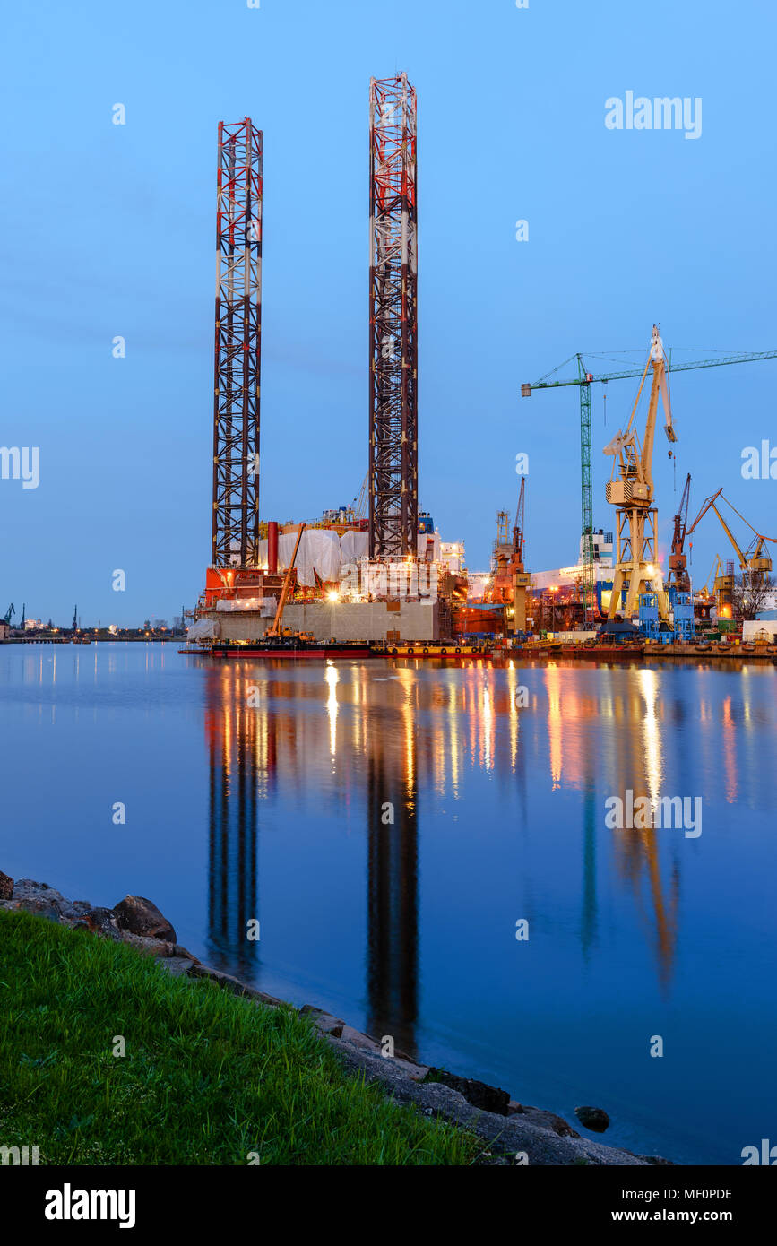 Oil rig docked in shipyard of Gdansk at dusk. Poland Stock Photo - Alamy