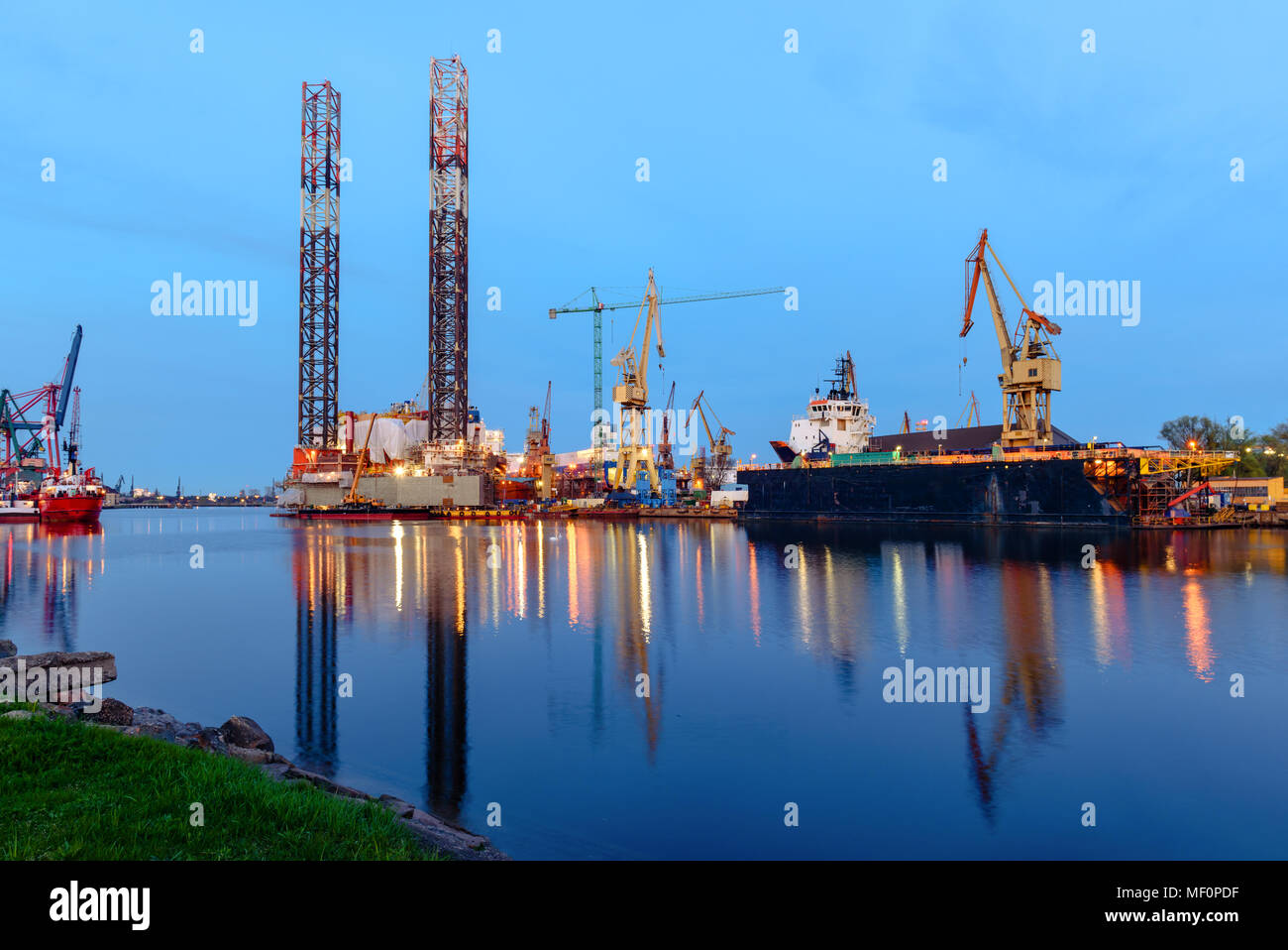 Oil rig docked in shipyard of Gdansk in dusk. Poland Stock Photo - Alamy