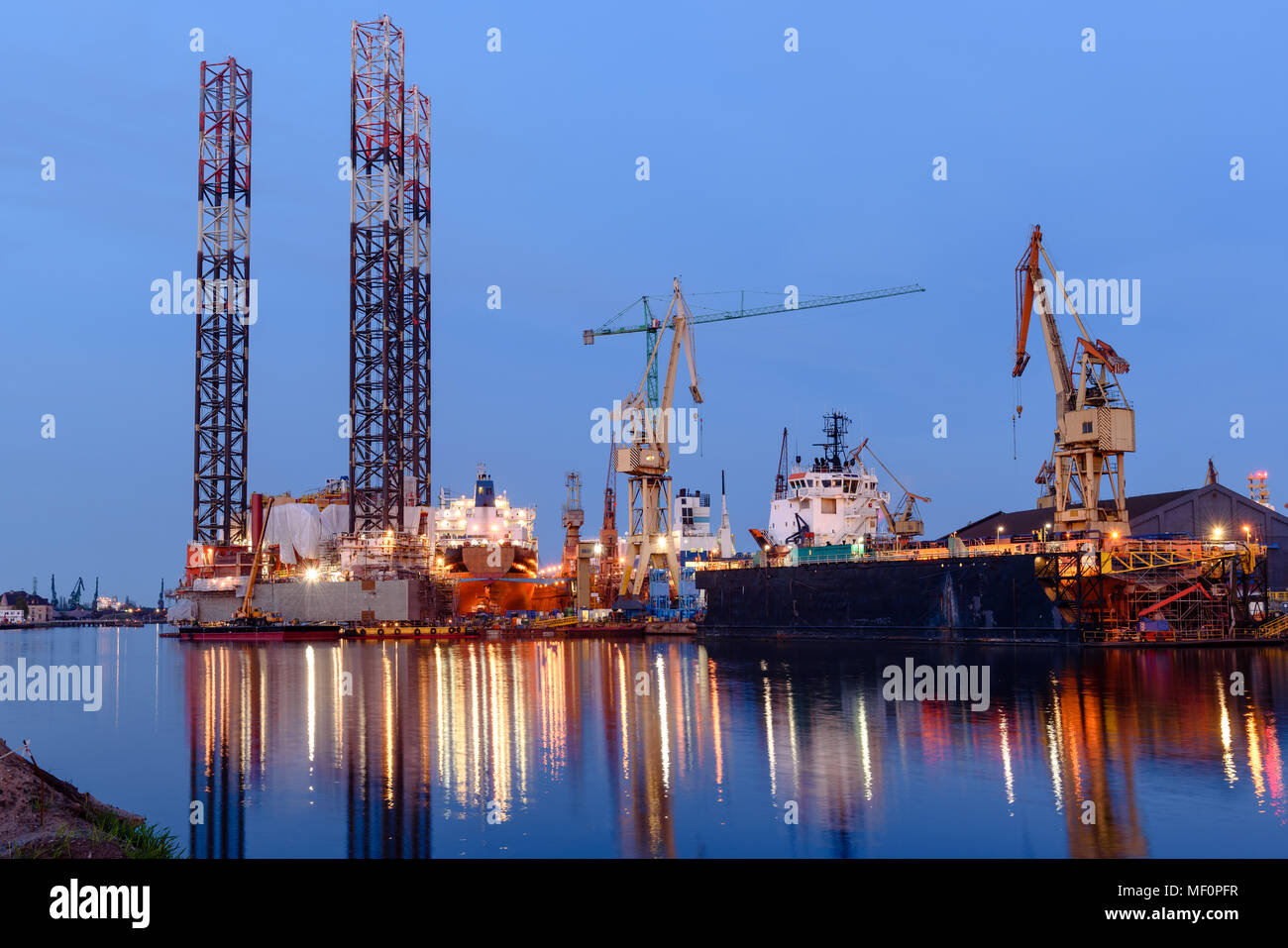 Oil rig docked in shipyard of Gdansk at dusk. Poland Stock Photo - Alamy
