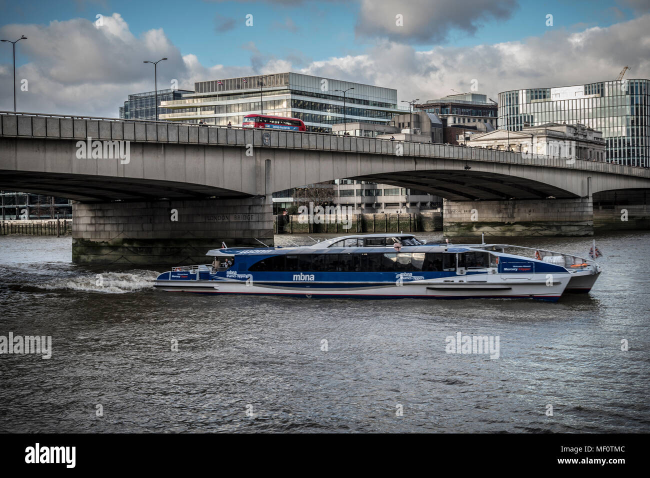 River boat passing through London Bridge, London, England, GB Stock ...