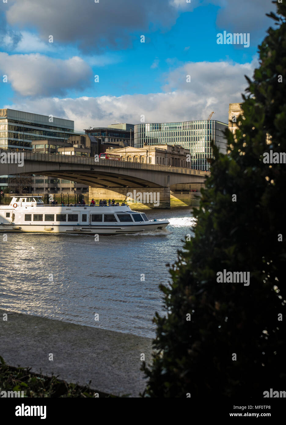 Boat passing underneath London Bridge, London, England, UK Stock Photo ...