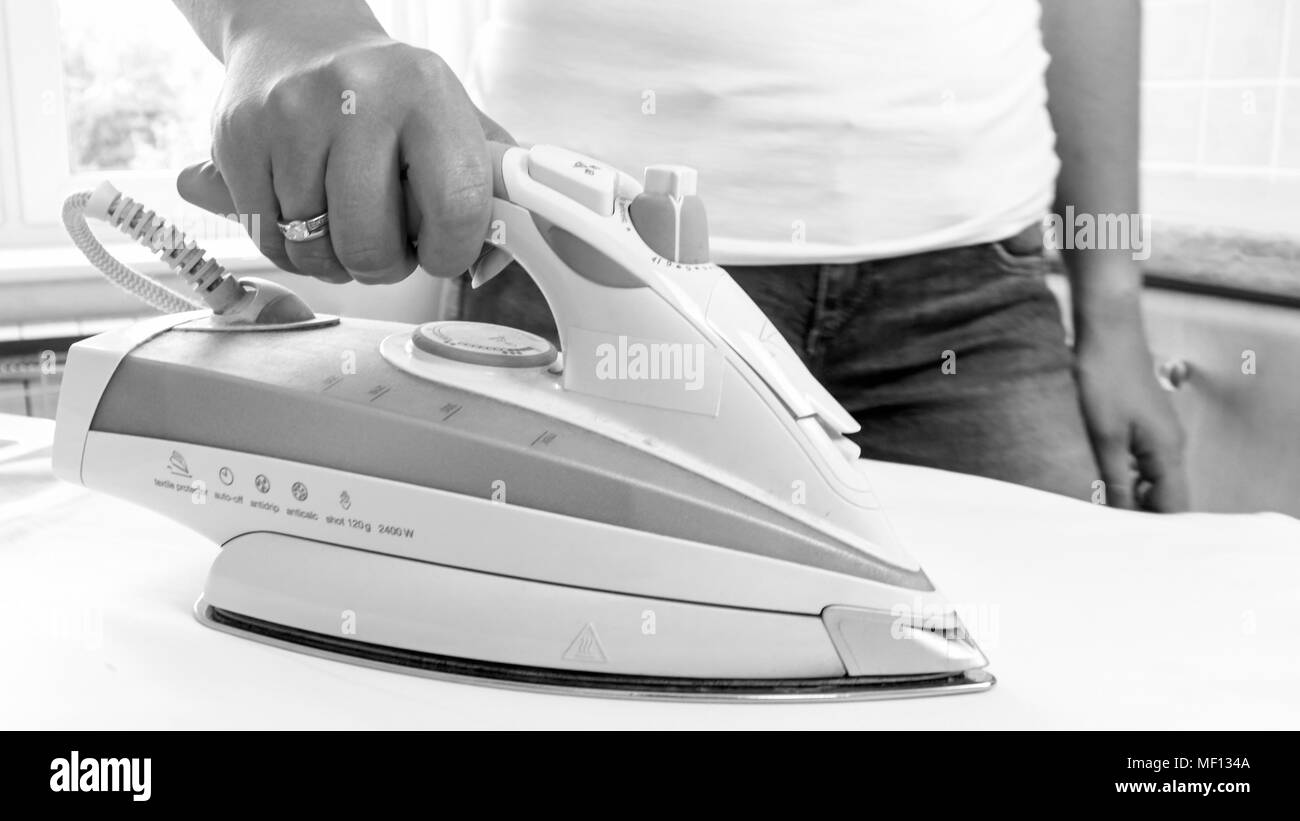 Domestic electric iron Black and White Stock Photos & Images - Alamy