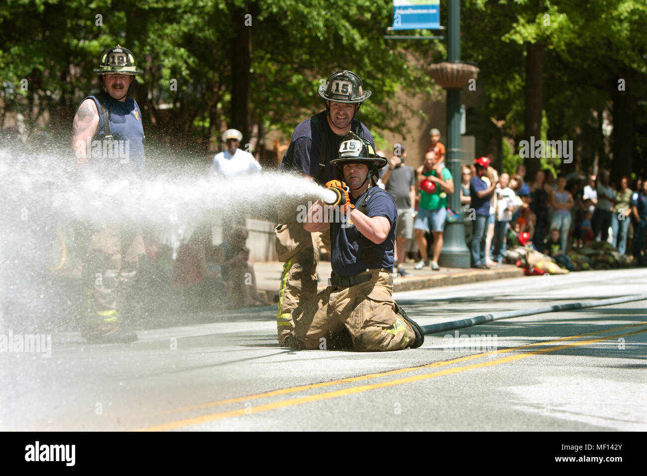 Fireman kneeling hi-res stock photography and images - Alamy