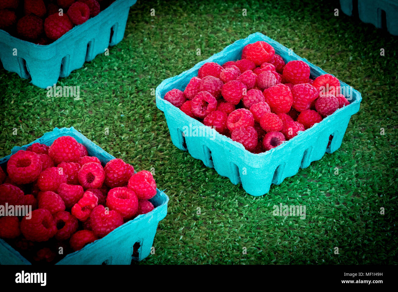 box of raspberries - stunning red color Stock Photo - Alamy