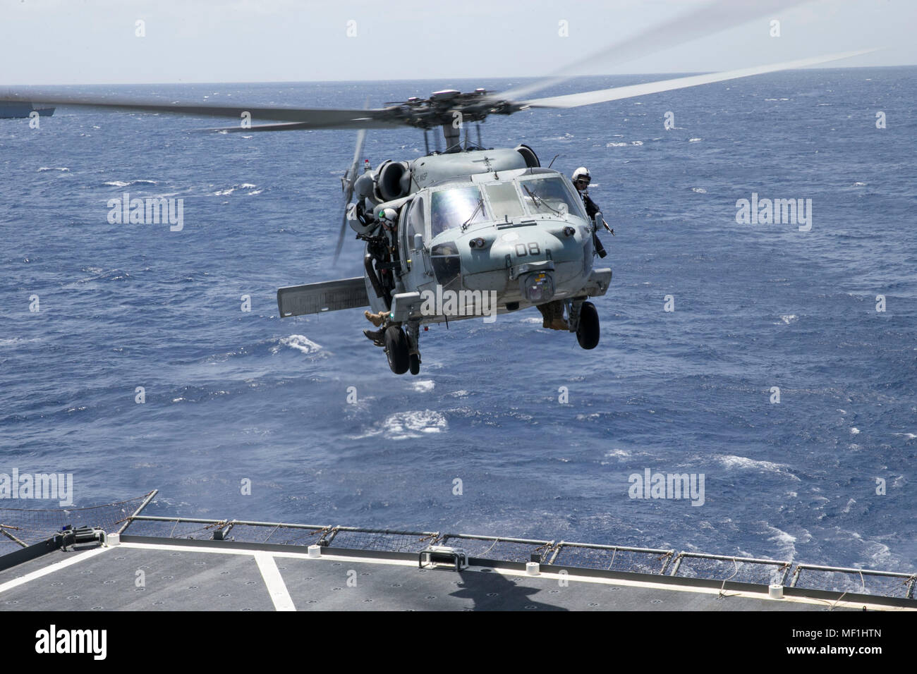 An MH-60s Sea Hawk prepares to land during Visit, Board, Search, and ...