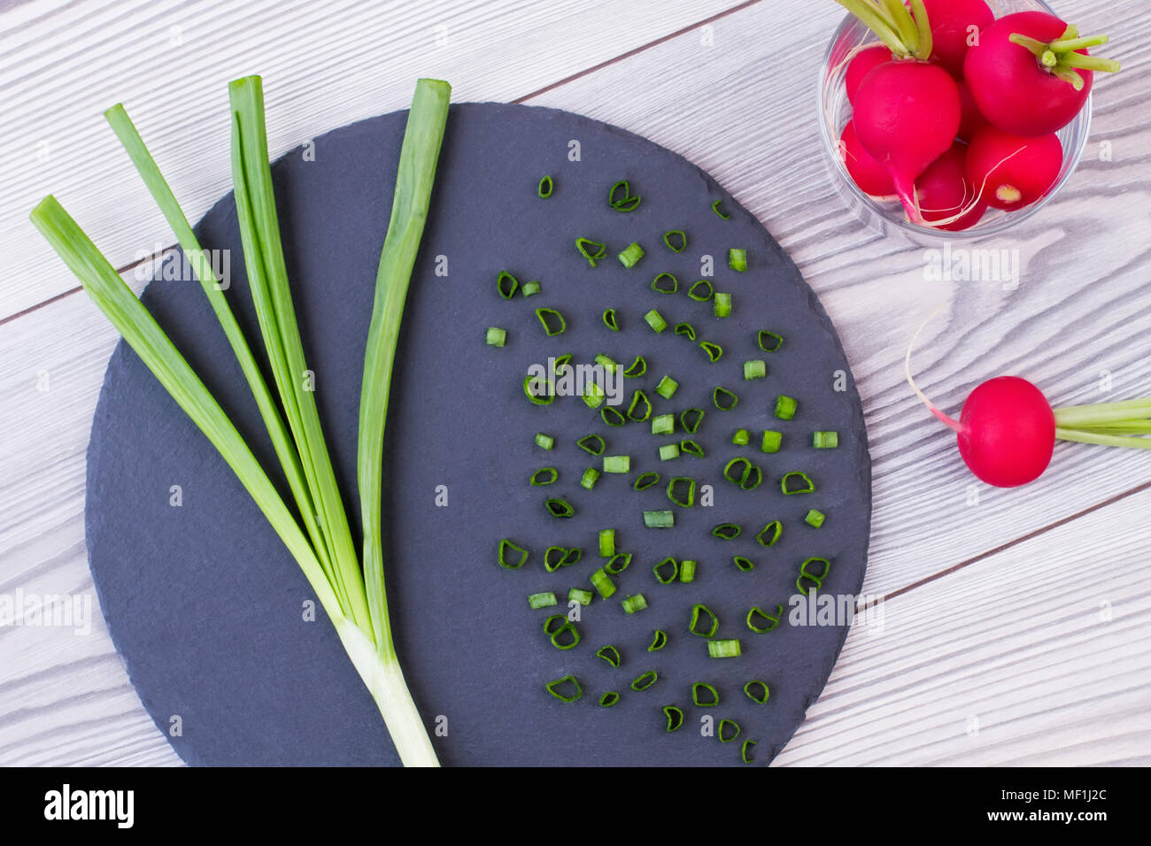 Whole and sliced green spring onion Stock Photo - Alamy