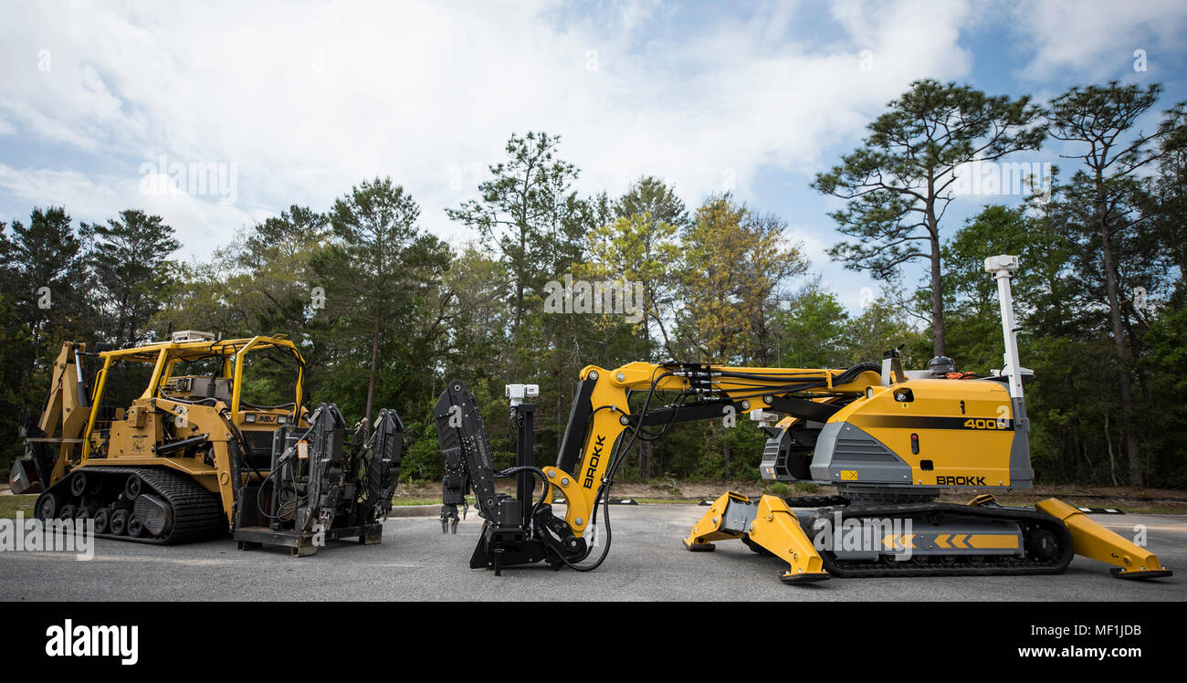 The all-purpose remote controlled transport (left) sits next to its ...