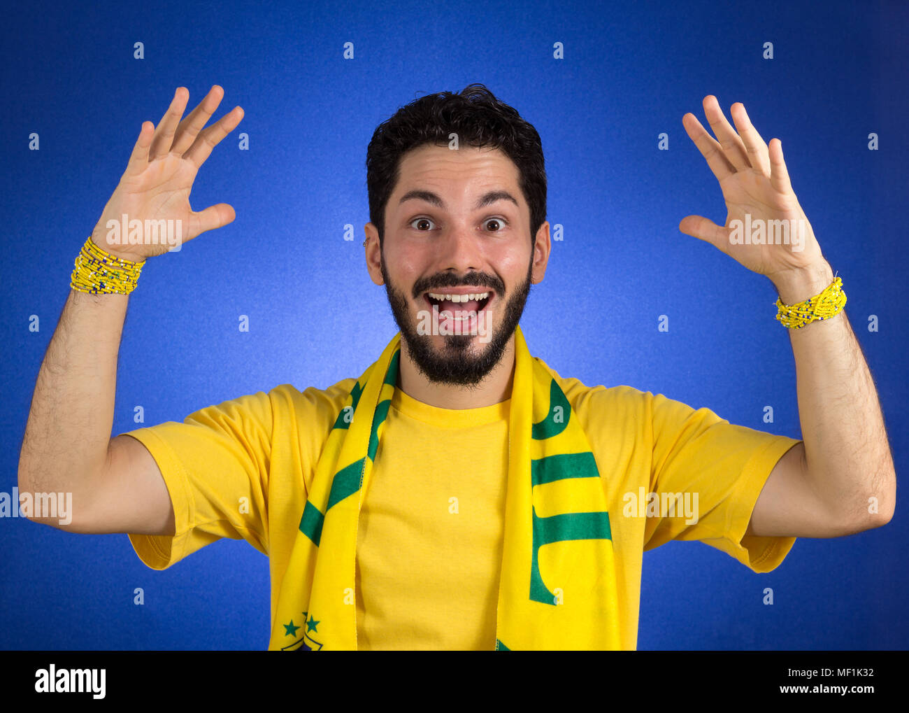 Soccer fan in action emotions: happy, amazed. Supporter of Brazil ...