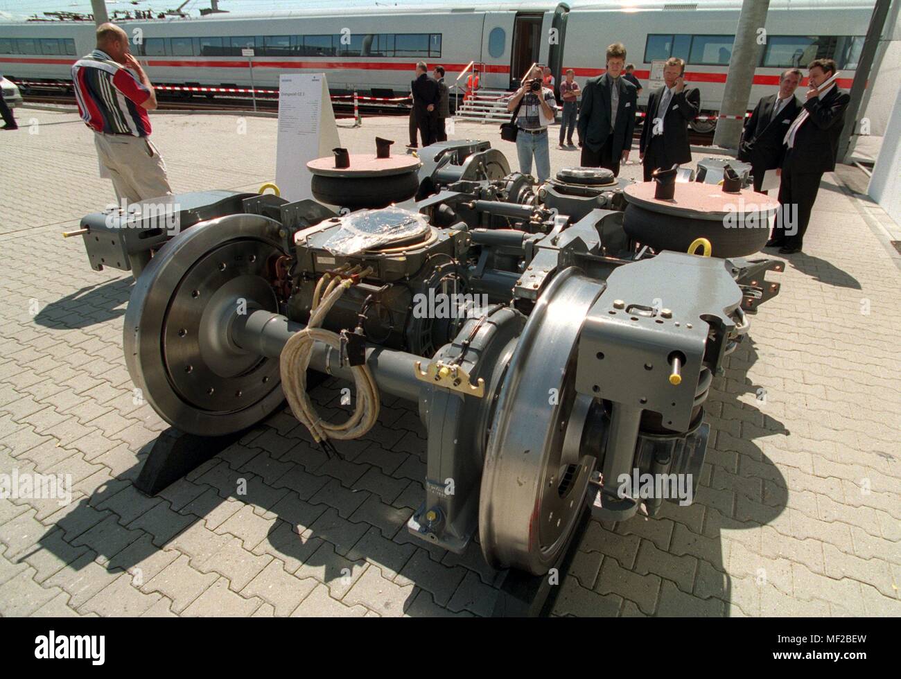 A chassis of the new ICE 3 (background), so-called monobloc wheels, is ...