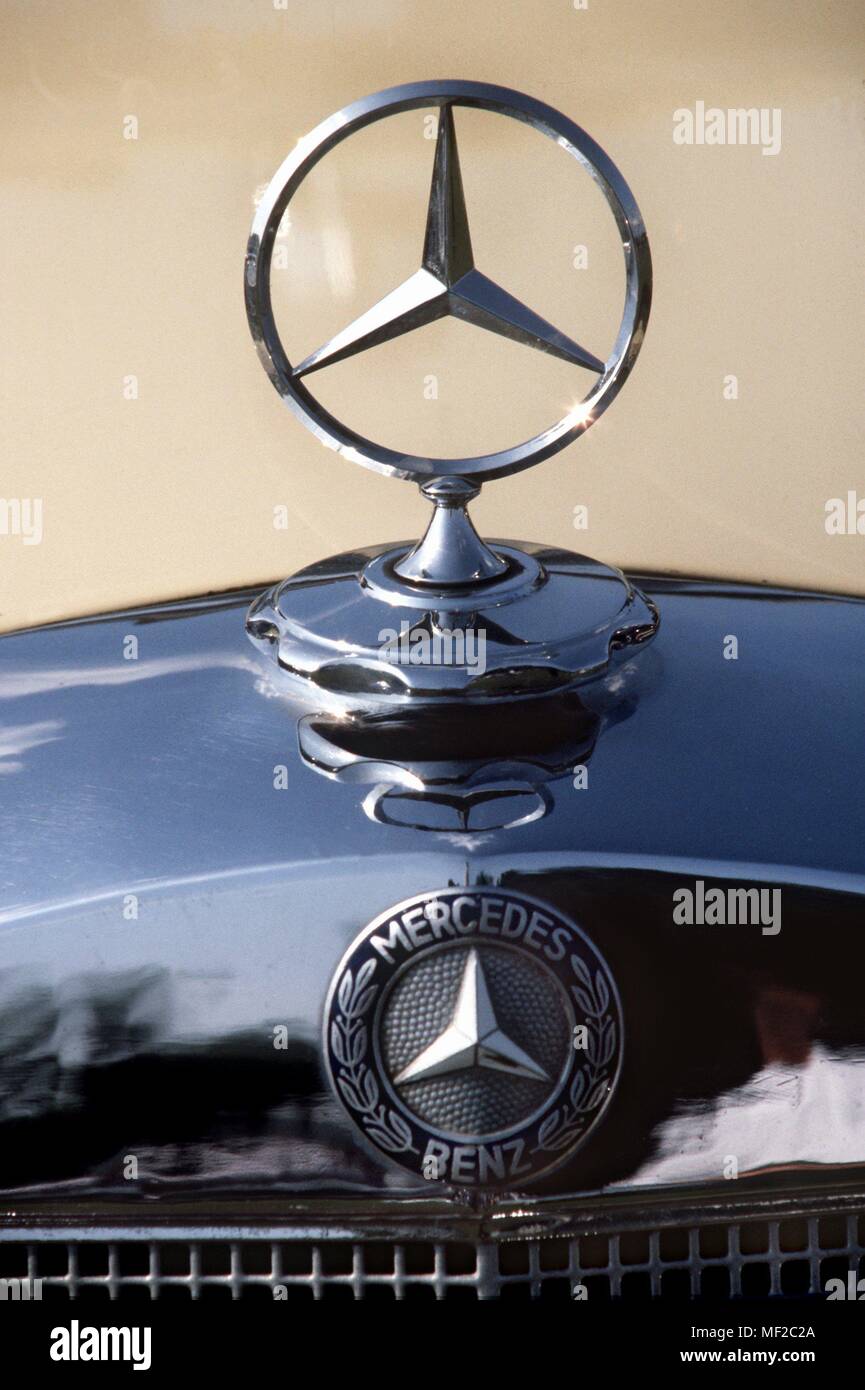View of a Mercedes star and the emblem with the inscription Mercedes ...