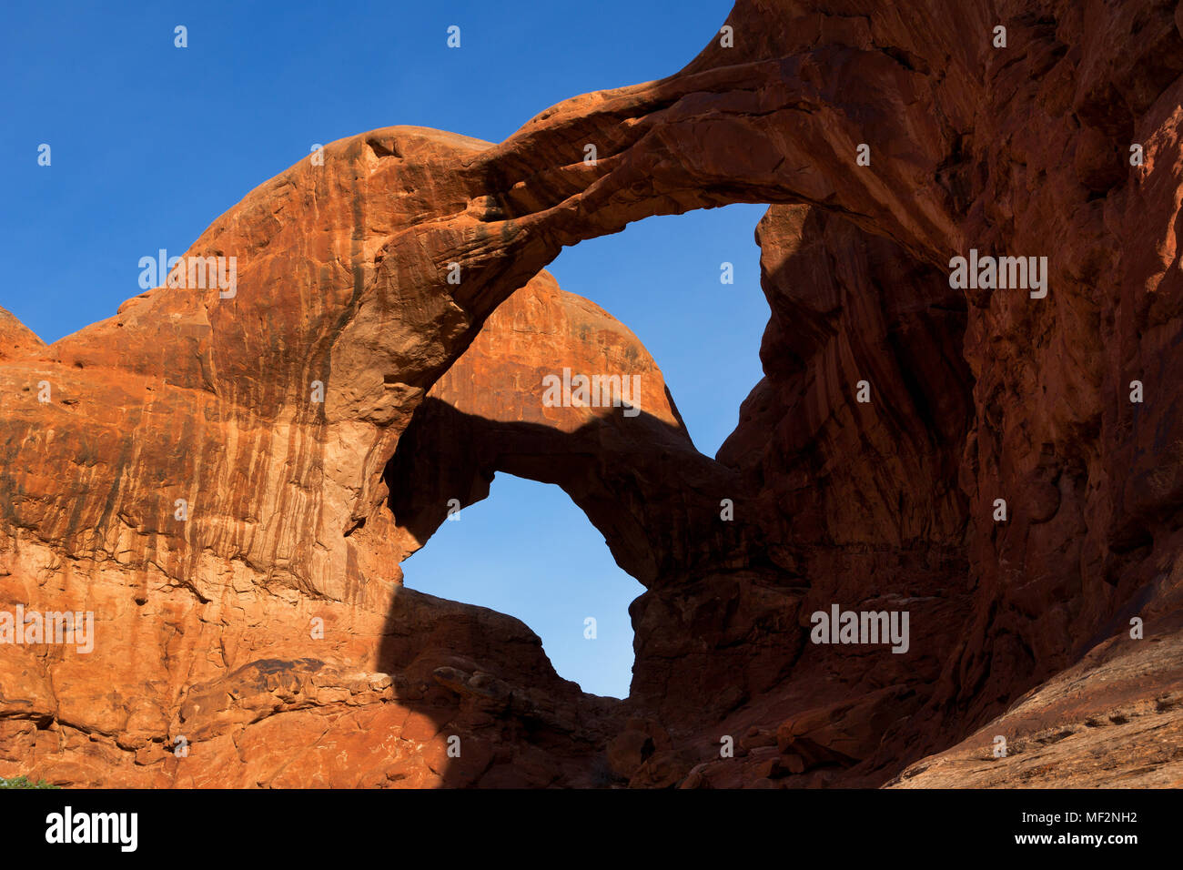 Double arch sunset arches national park hi-res stock photography and ...