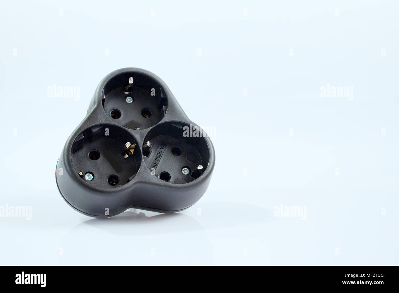 Isolated triple plug adapter on white background Stock Photo - Alamy