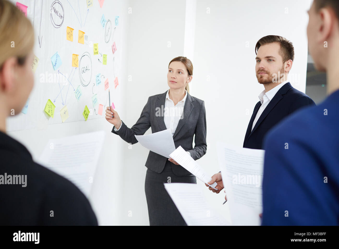 Business people having a presentation at office. Woman speaking at the ...