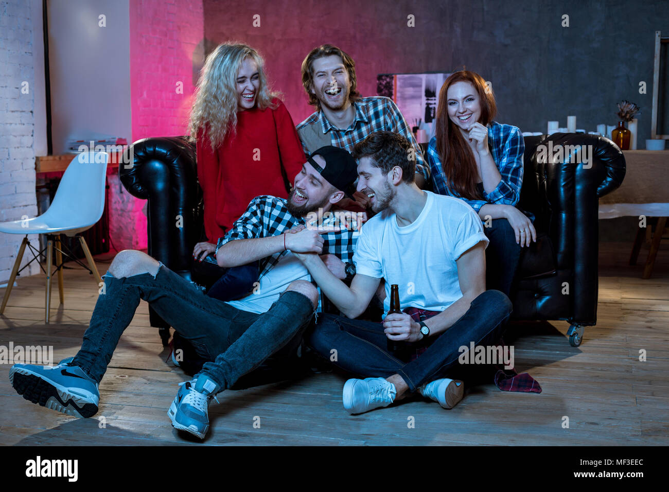 Group of friends watching TV match at home Stock Photo - Alamy