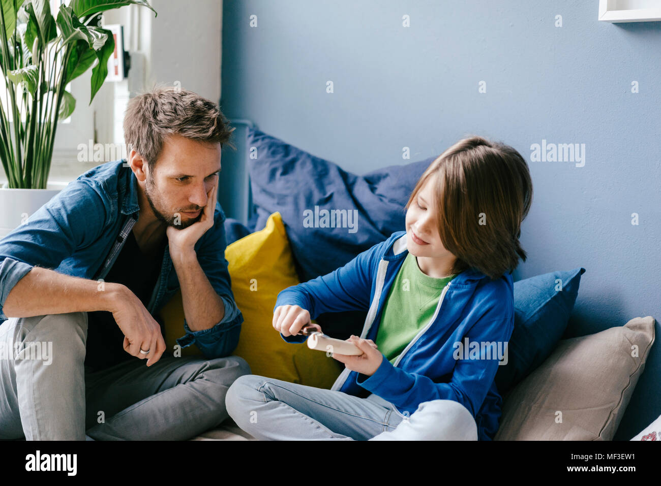 Seated man carving hi-res stock photography and images - Alamy