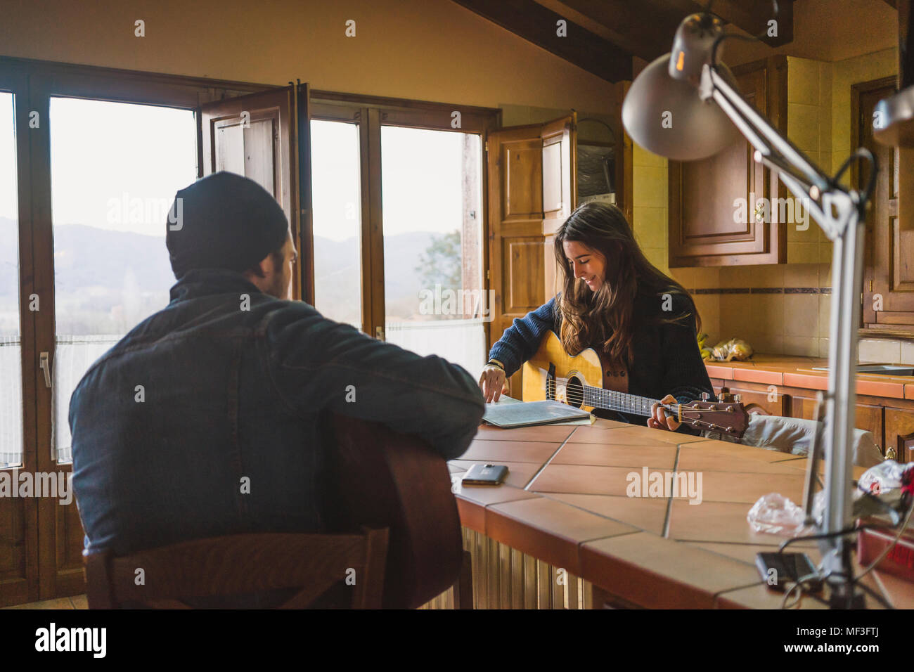 Couple playing musical instruments hi-res stock photography and images ...