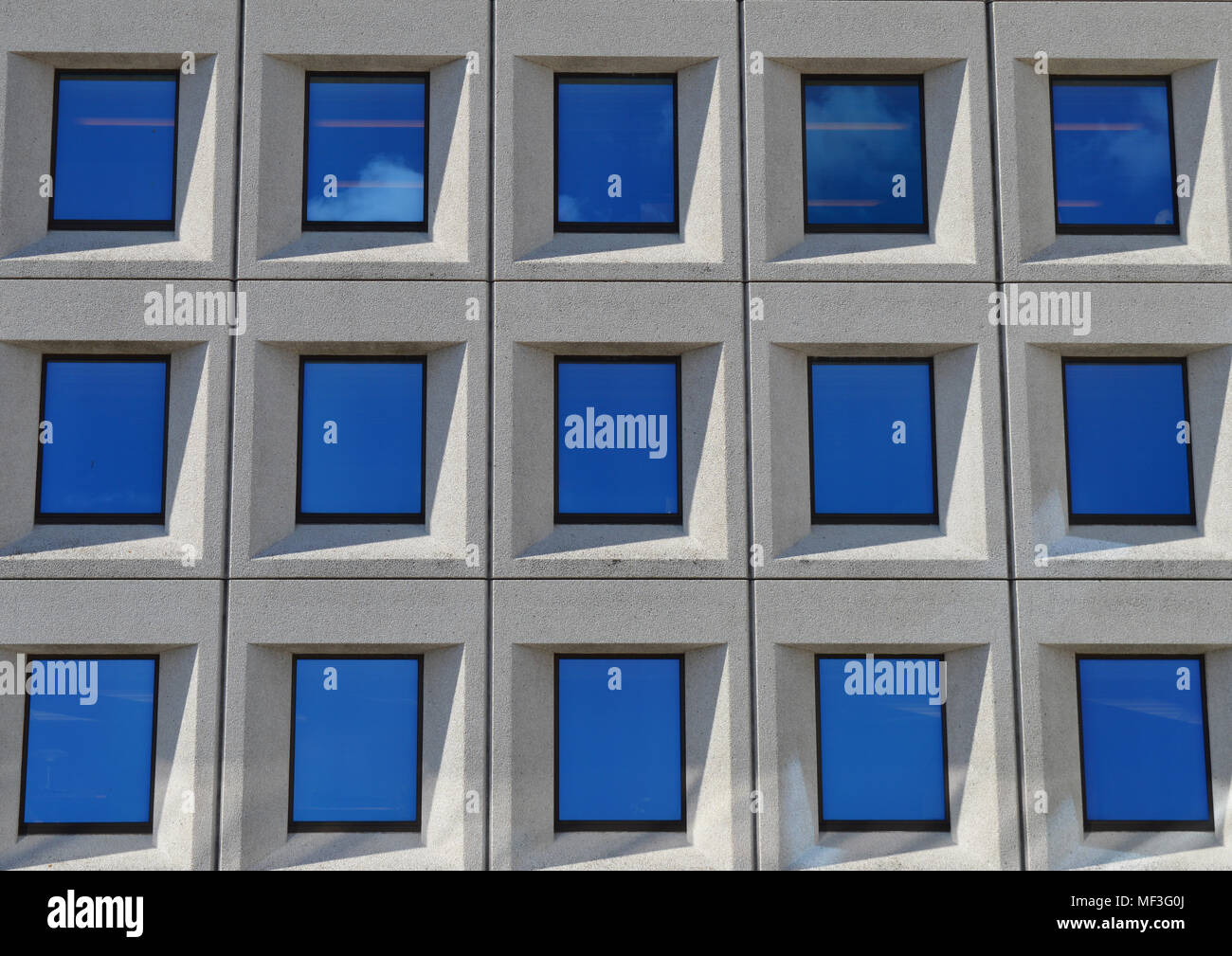 Beautiful symmetry windows with clouds reflection Stock Photo - Alamy