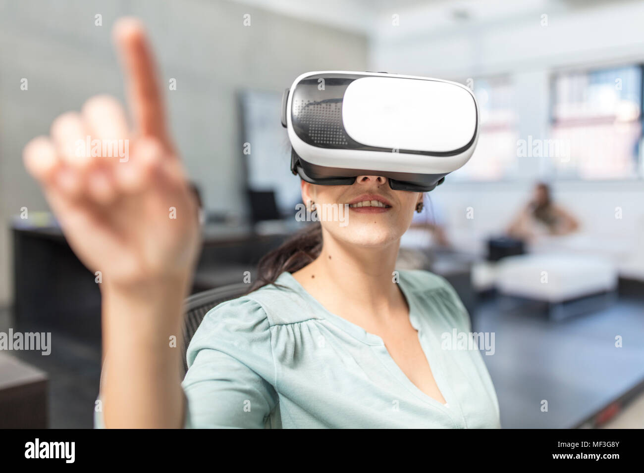 Pointing woman wearing vr hi-res stock photography and images - Alamy