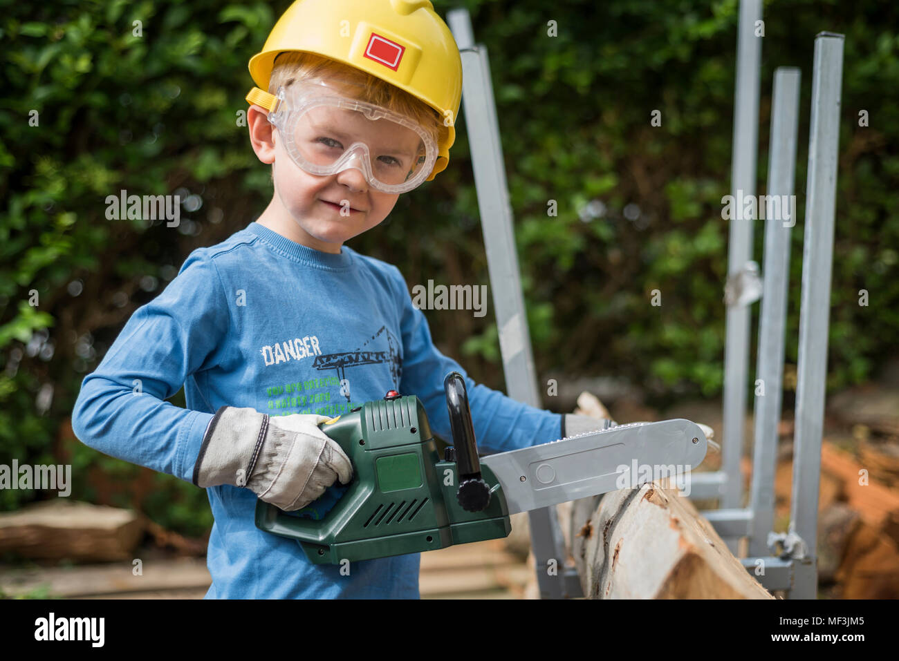 Boy with saw hi-res stock photography and images - Alamy