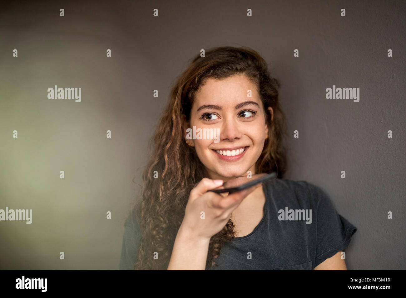 Portrait of teenage girl using cell phone Stock Photo - Alamy