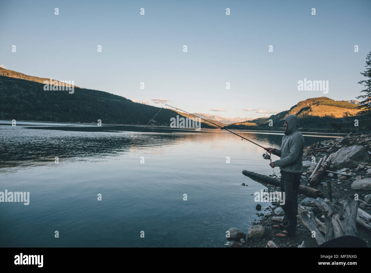 Man fishing at kinbasket lake hi-res stock photography and images - Alamy