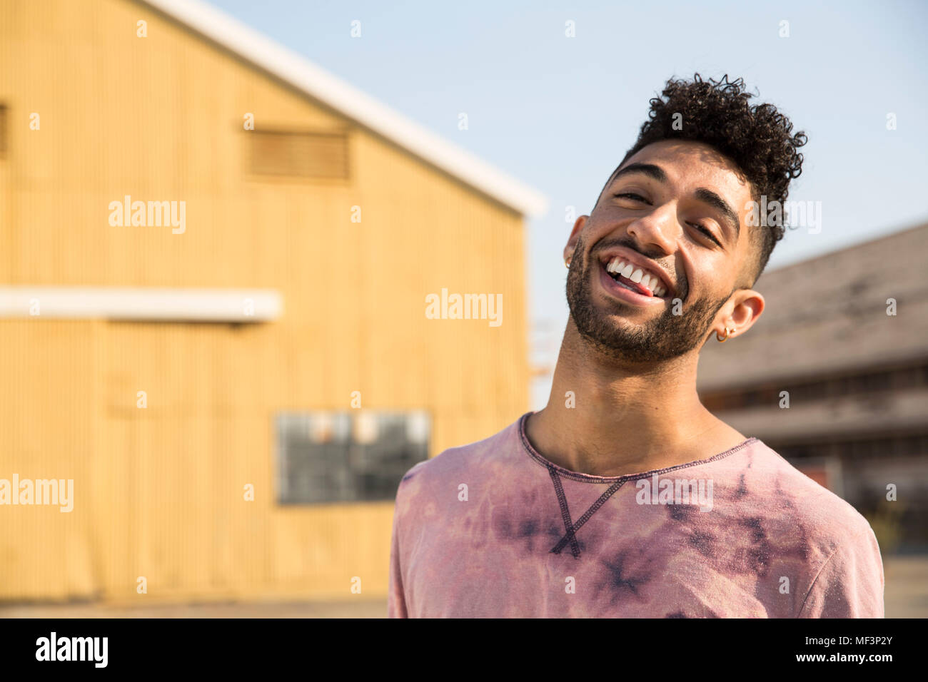 Portrait of happy young man outdoors Stock Photo - Alamy