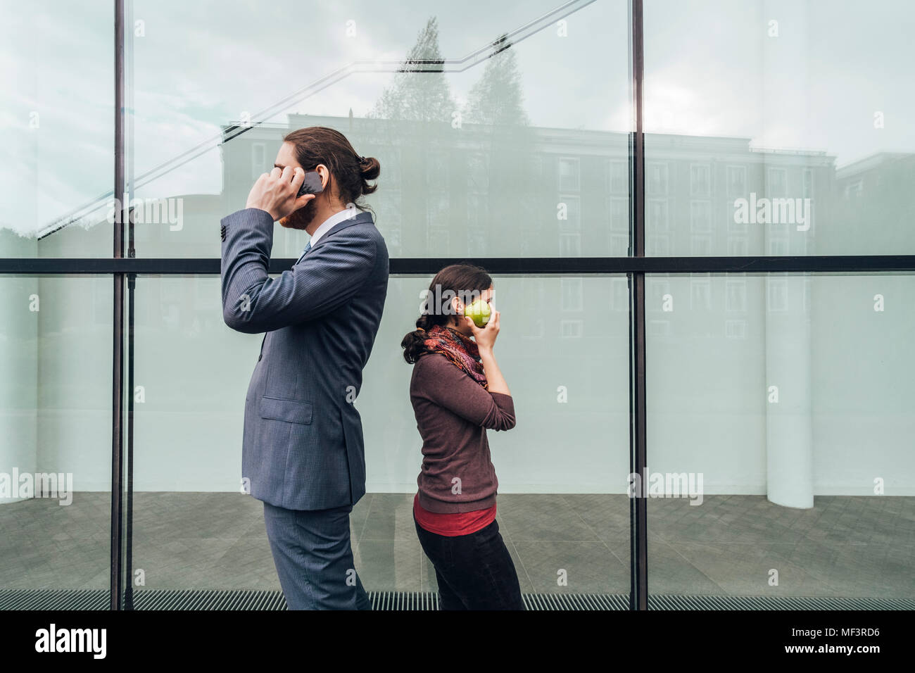 Man holding cell phone ear hi-res stock photography and images - Alamy