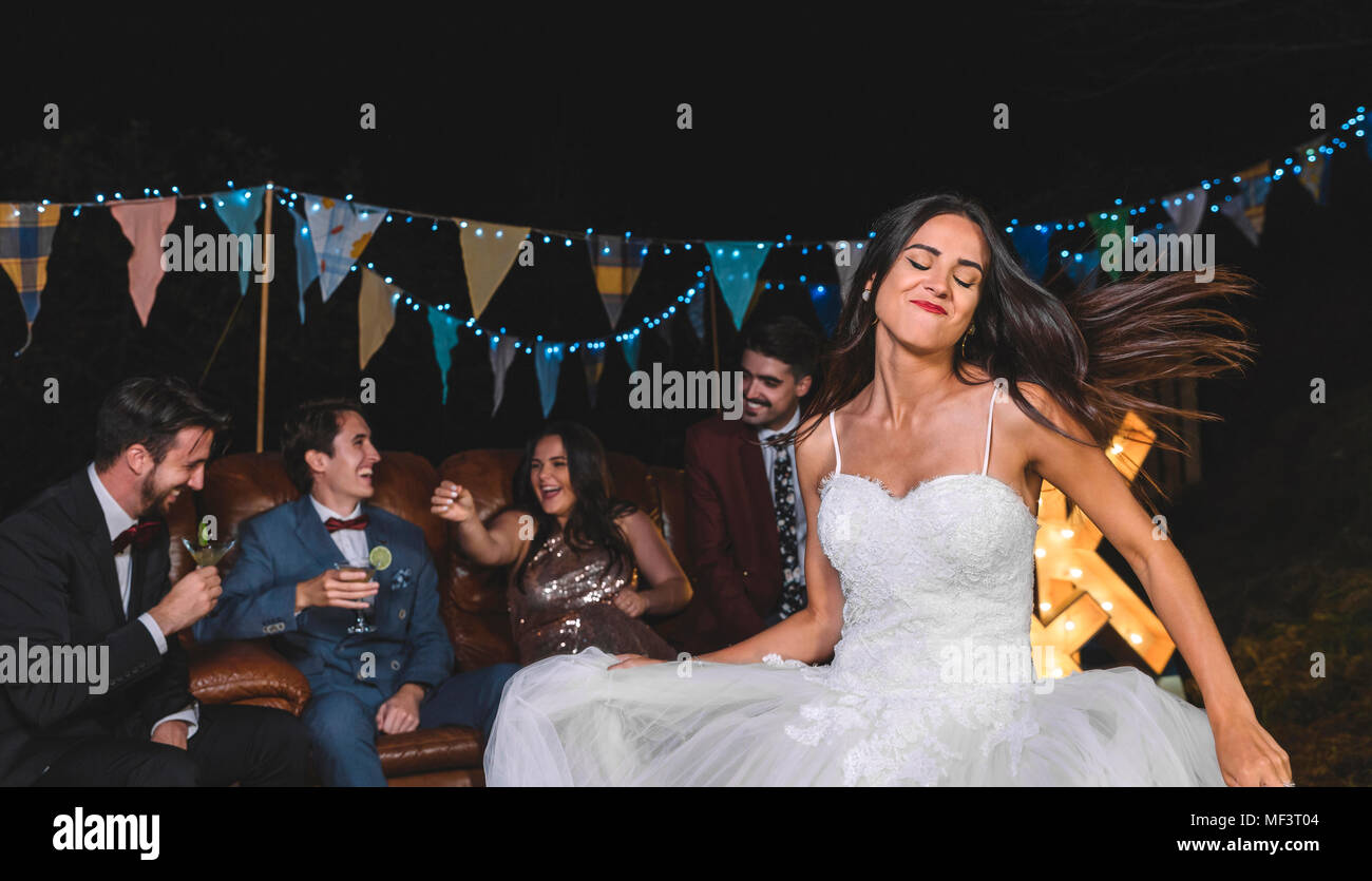 Bride dancing in field hi-res stock photography and images - Alamy