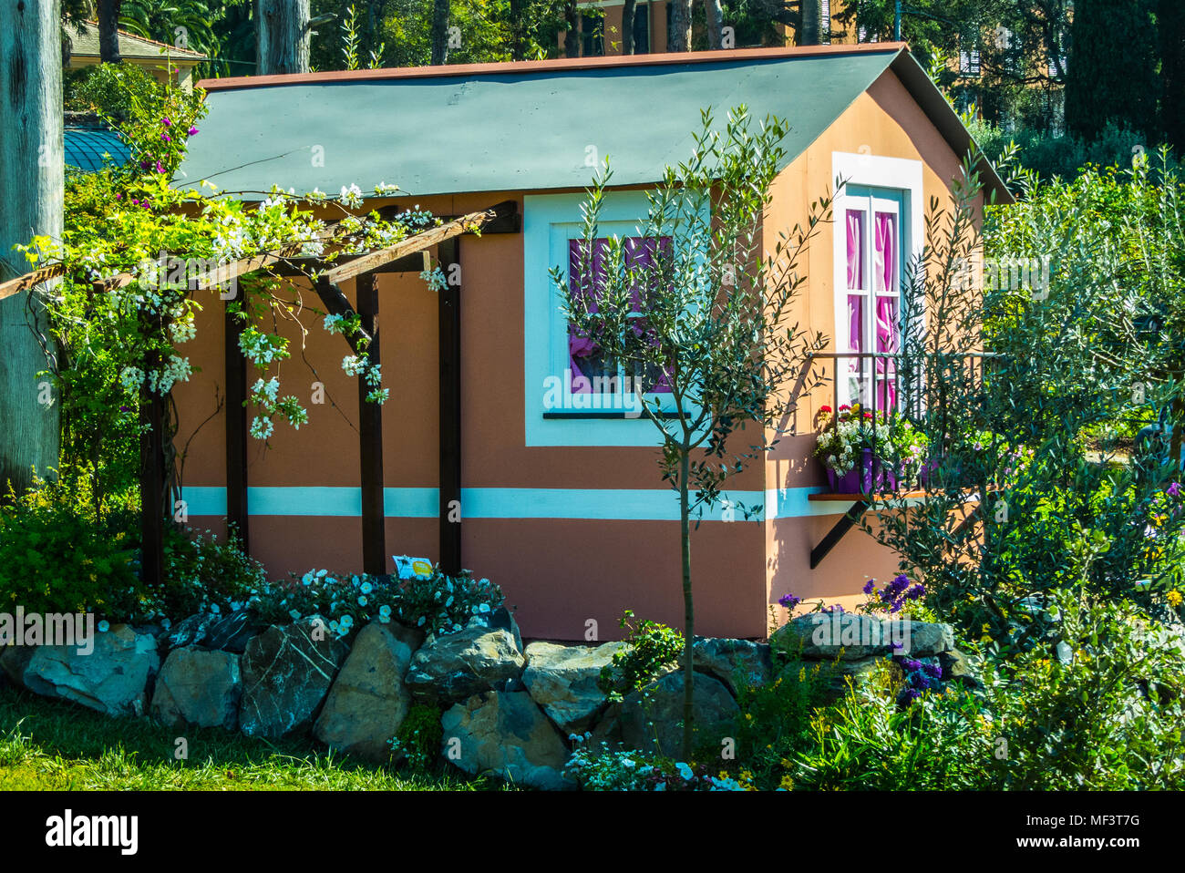 Orange little house in the garden Stock Photo - Alamy